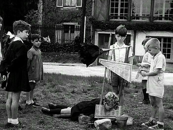 French children in the playground during recess, 1959. - USLUCK
