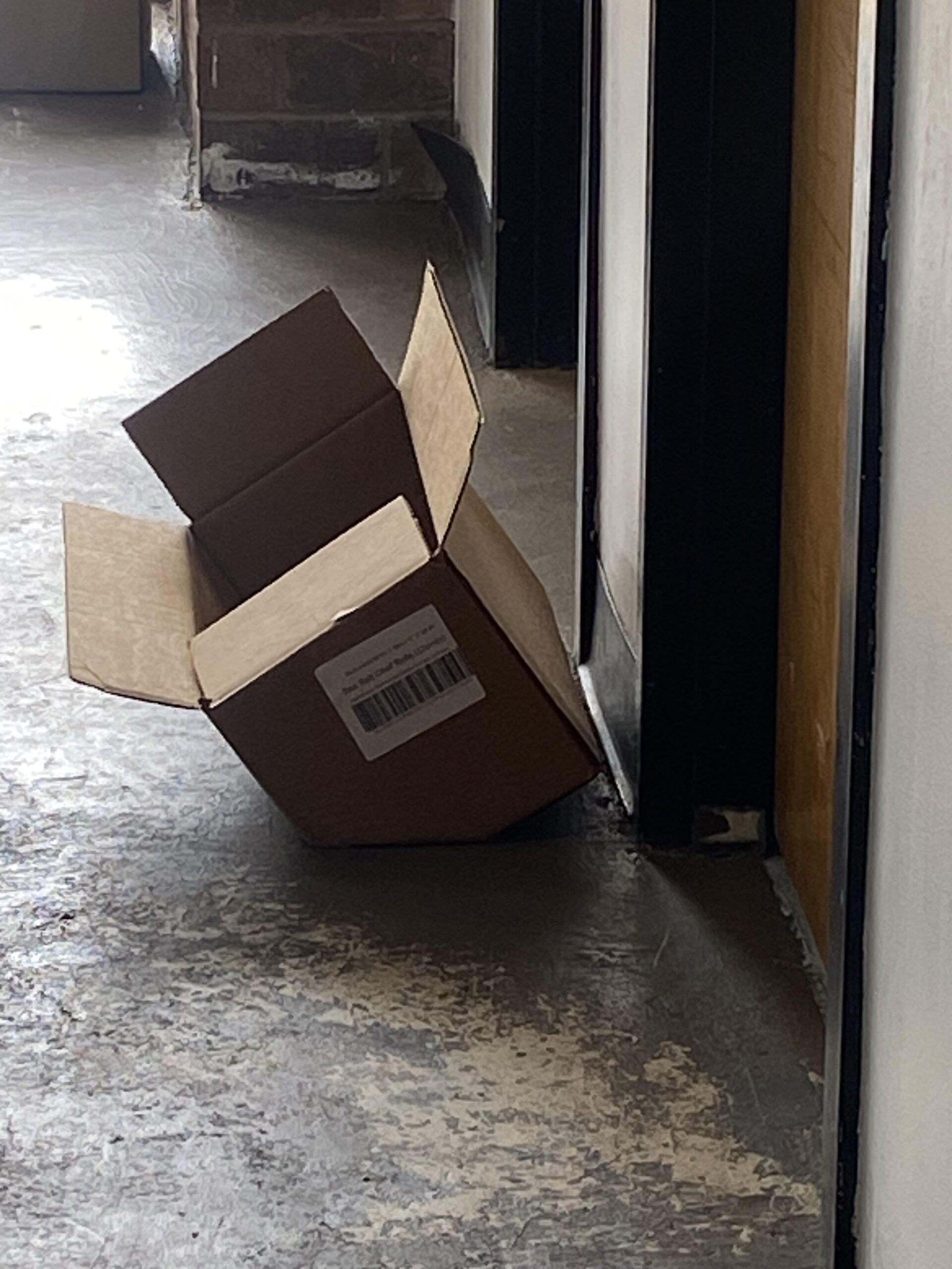 This partially crushed box looks like it’s glitching through the floor ...