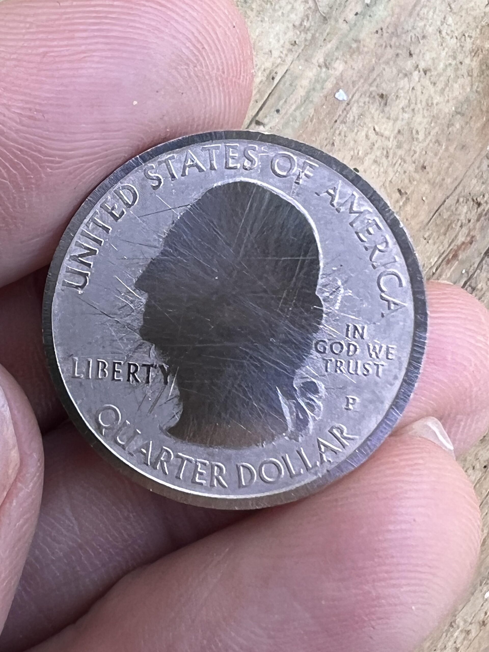 This quarter that got trapped in the bottom of the washer drum wore off ...