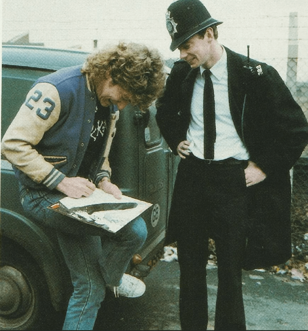 Robert plant signing the first zeppelin album for a policemen in the ...