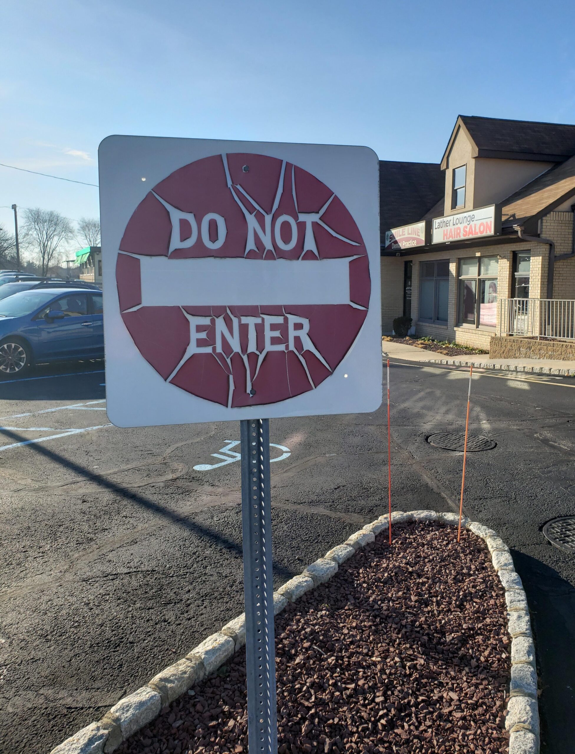A Do Not Enter sign by a local strip mall has gone full heavy metal ...