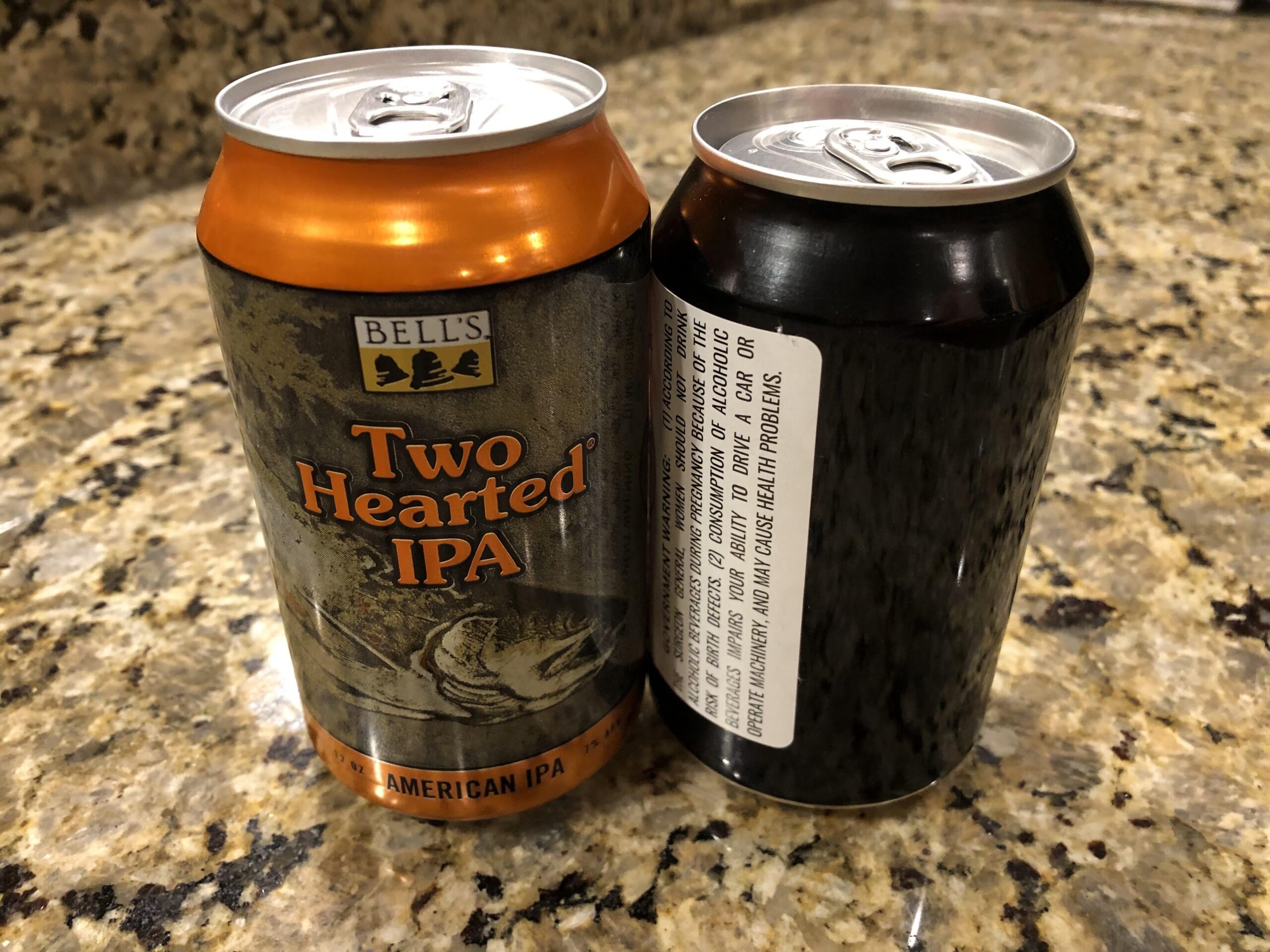 A local brewery sells their beer (right) in 11 oz cans instead of ...