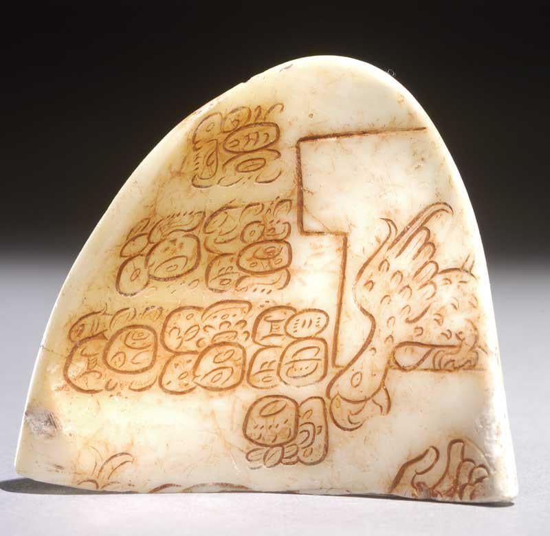 [800 x 779] A fragment of an engraved shell, bearing a scene and text ...