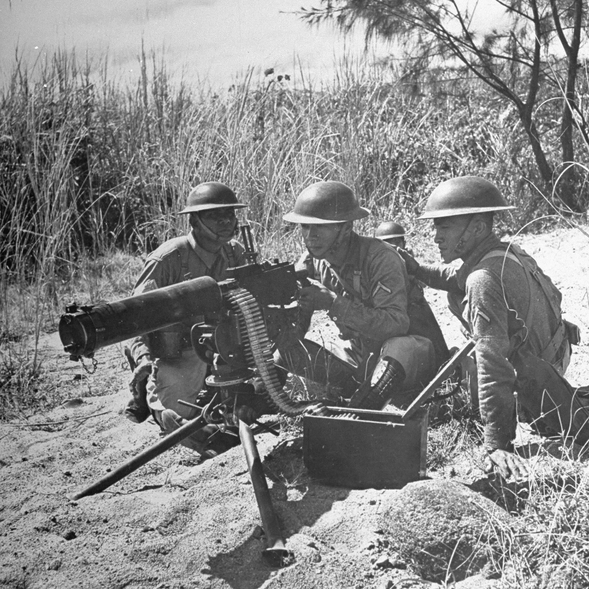 Filipino soldiers training with machine gun, 1941. Photo by Carl Mydans ...