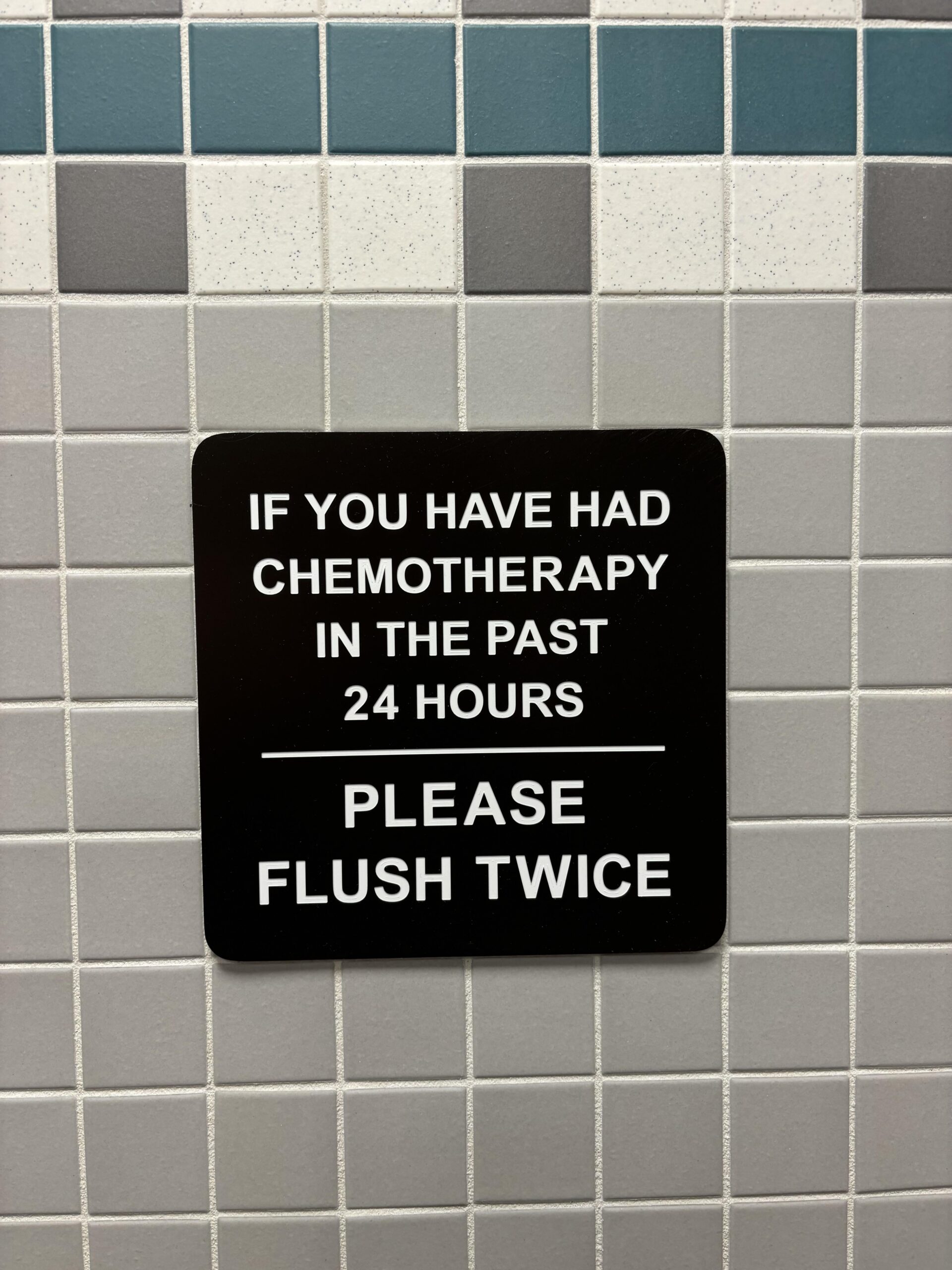 Sign in a medical office telling chemo patients to flush twice - USLUCK